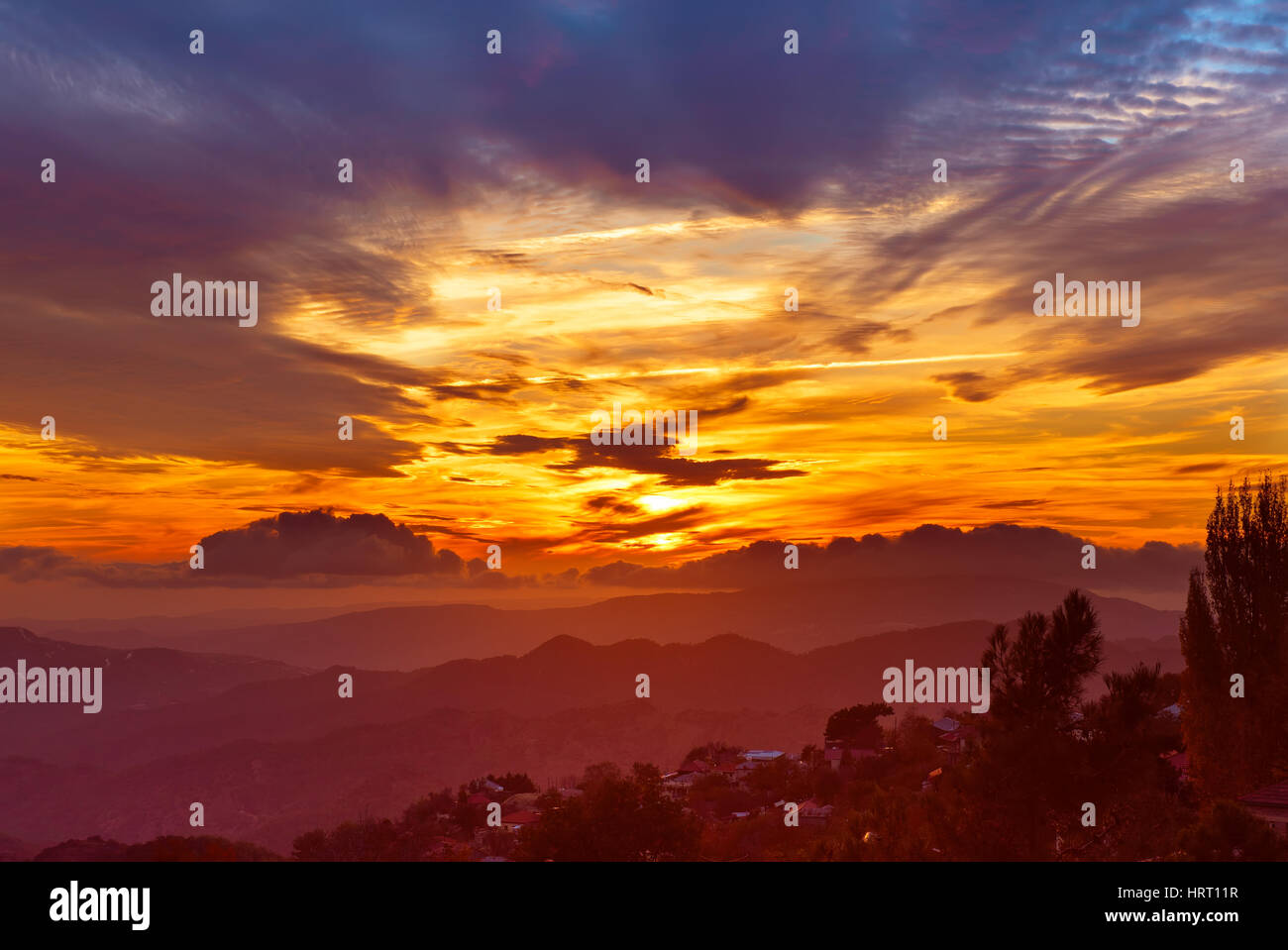 Amazing mountain landscape with colorful vivid sunset on the bright sky ...
