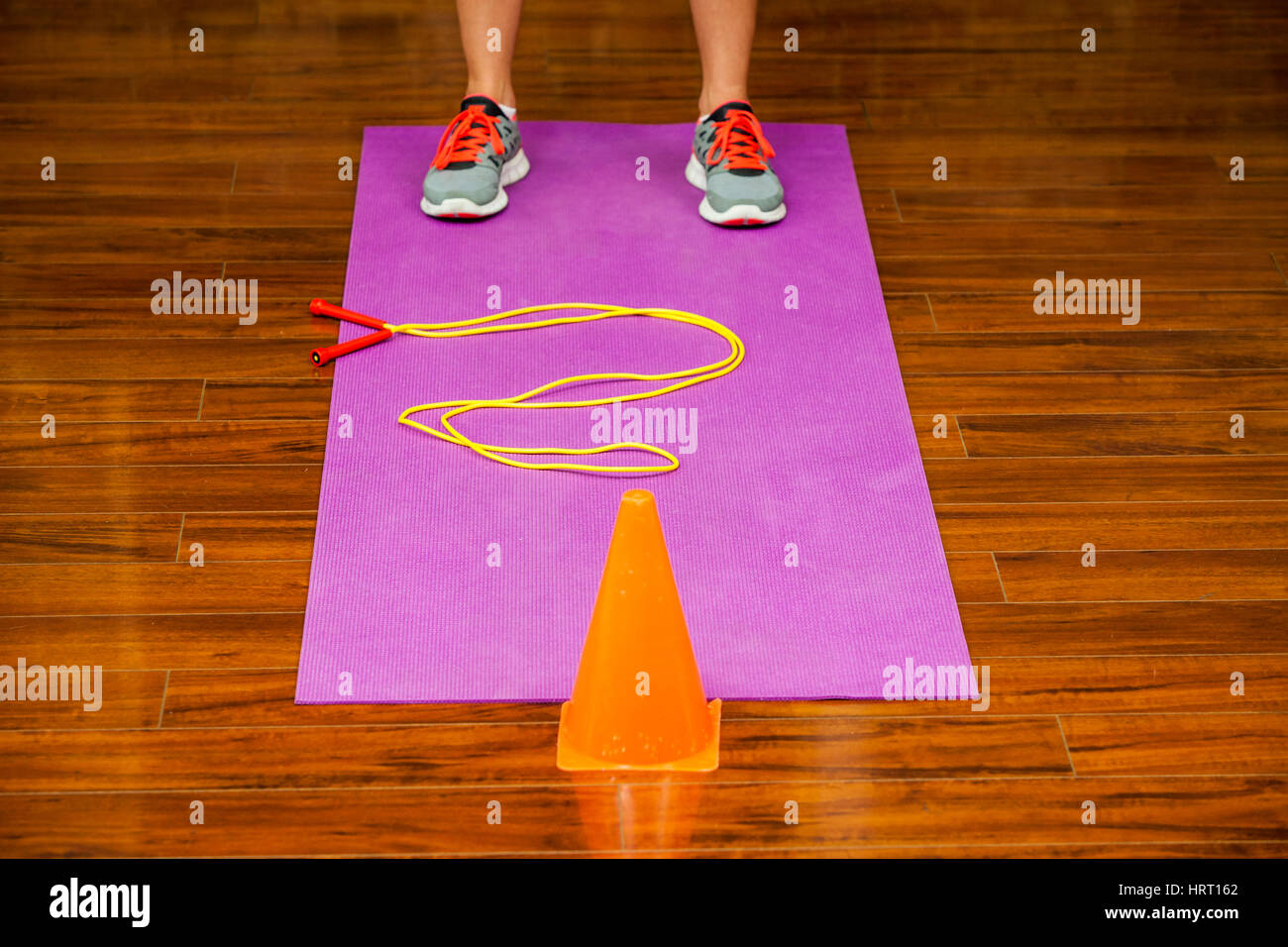 A woman standing ready for her workout / fitness class Stock Photo - Alamy