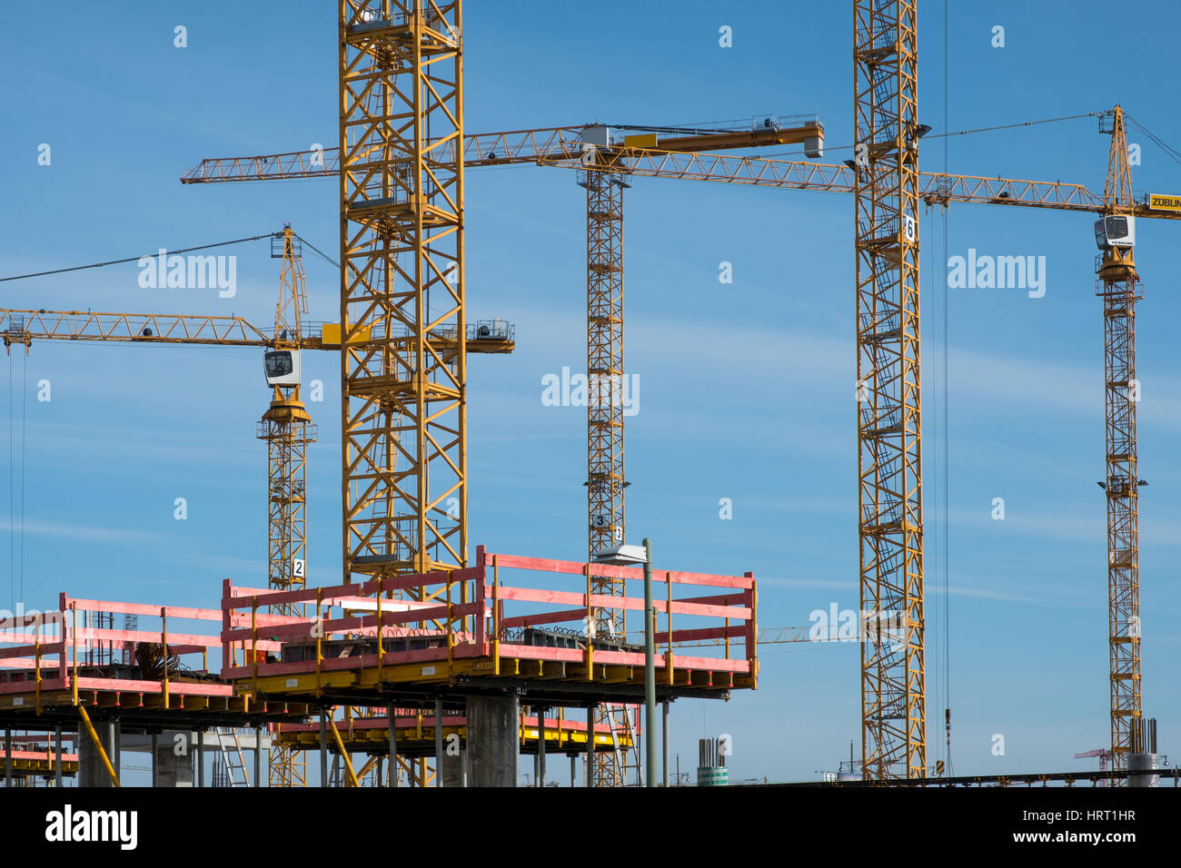 building construction site and cranes at work Stock Photo - Alamy