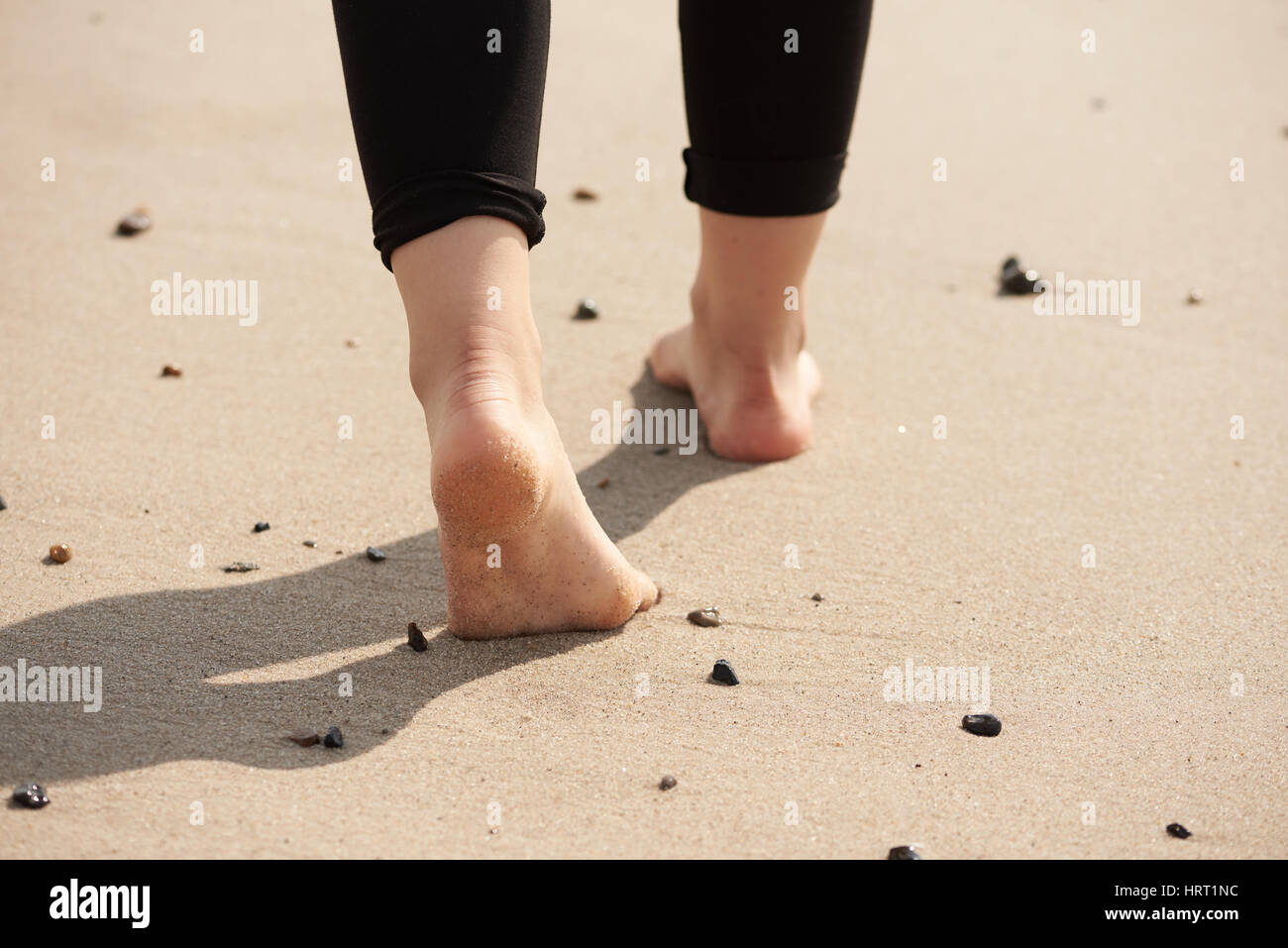 Human feet on the beach hi-res stock photography and images - Alamy