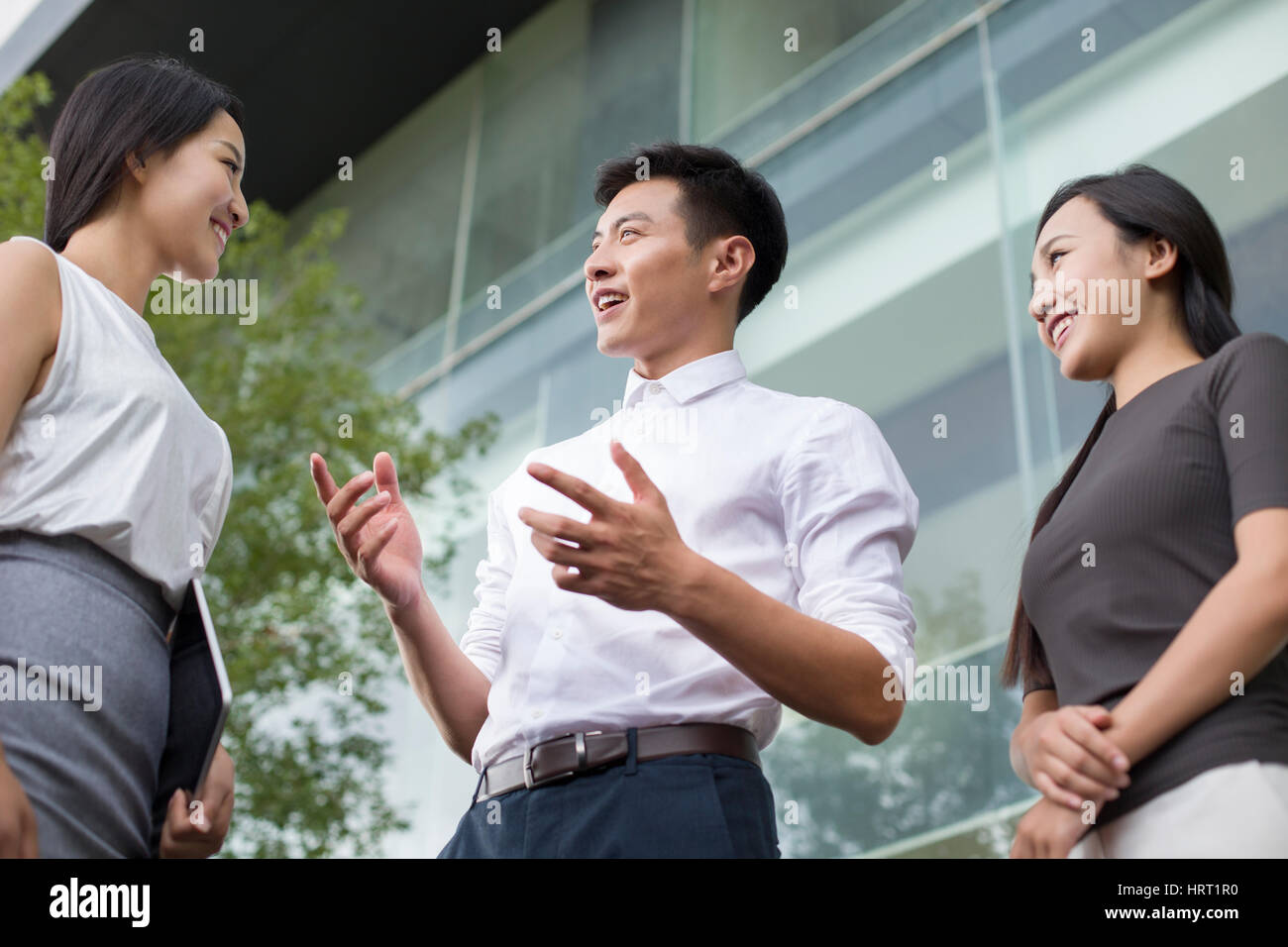 Confident business person talking Stock Photo - Alamy