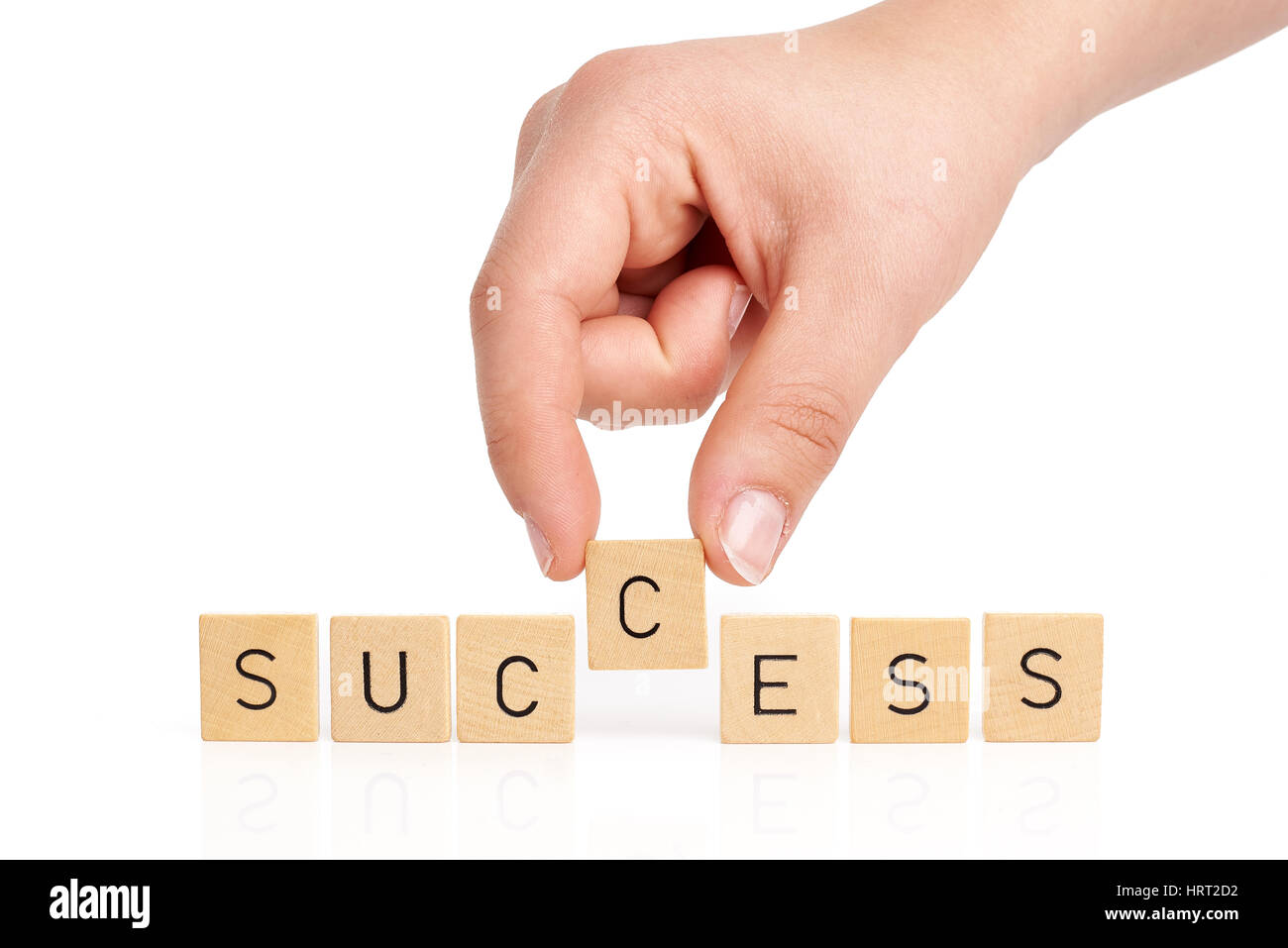 Hand is building the word success on white background Stock Photo - Alamy