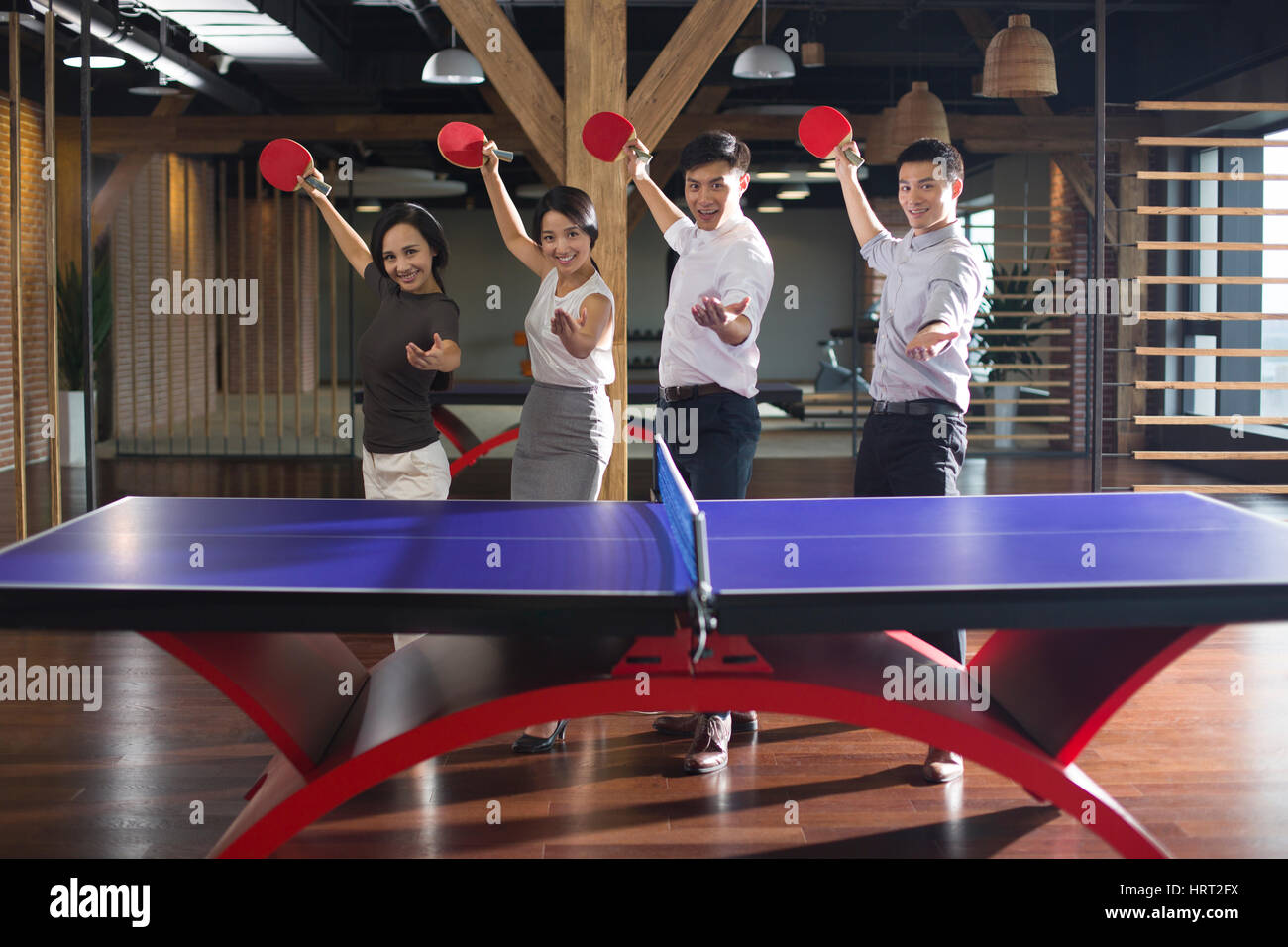 Young business person playing ping pong Stock Photo - Alamy
