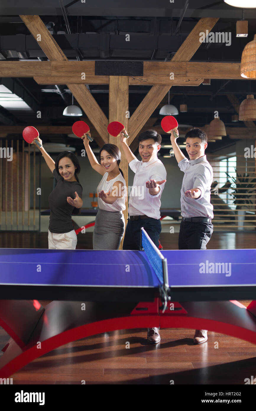 Young business person playing ping pong Stock Photo - Alamy