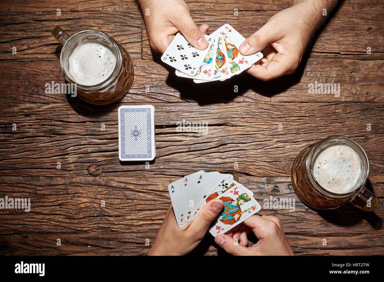Playing cards on table hi-res stock photography and images - Alamy