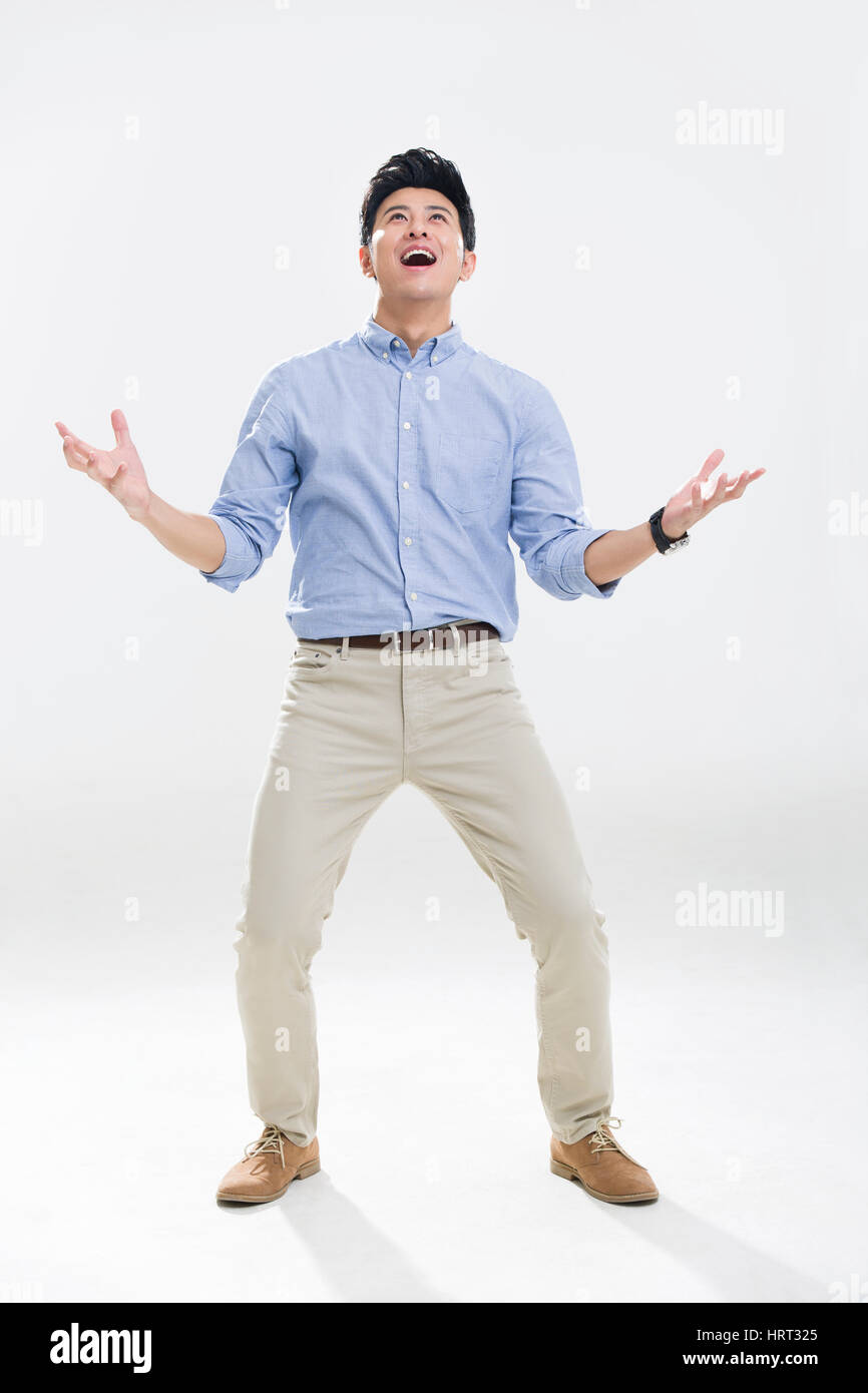 Excited young man Stock Photo - Alamy