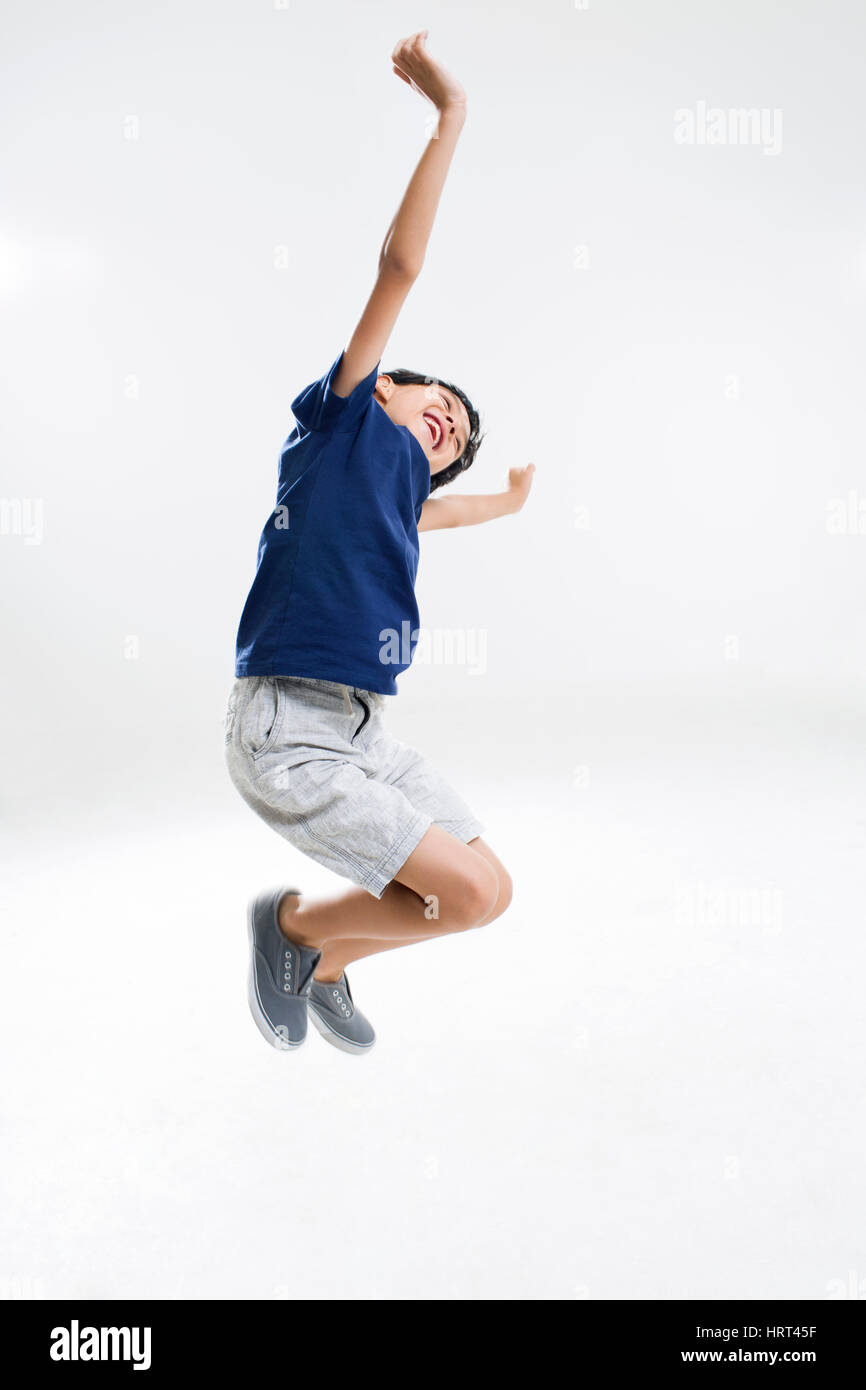 Cute little boy jumping Stock Photo - Alamy