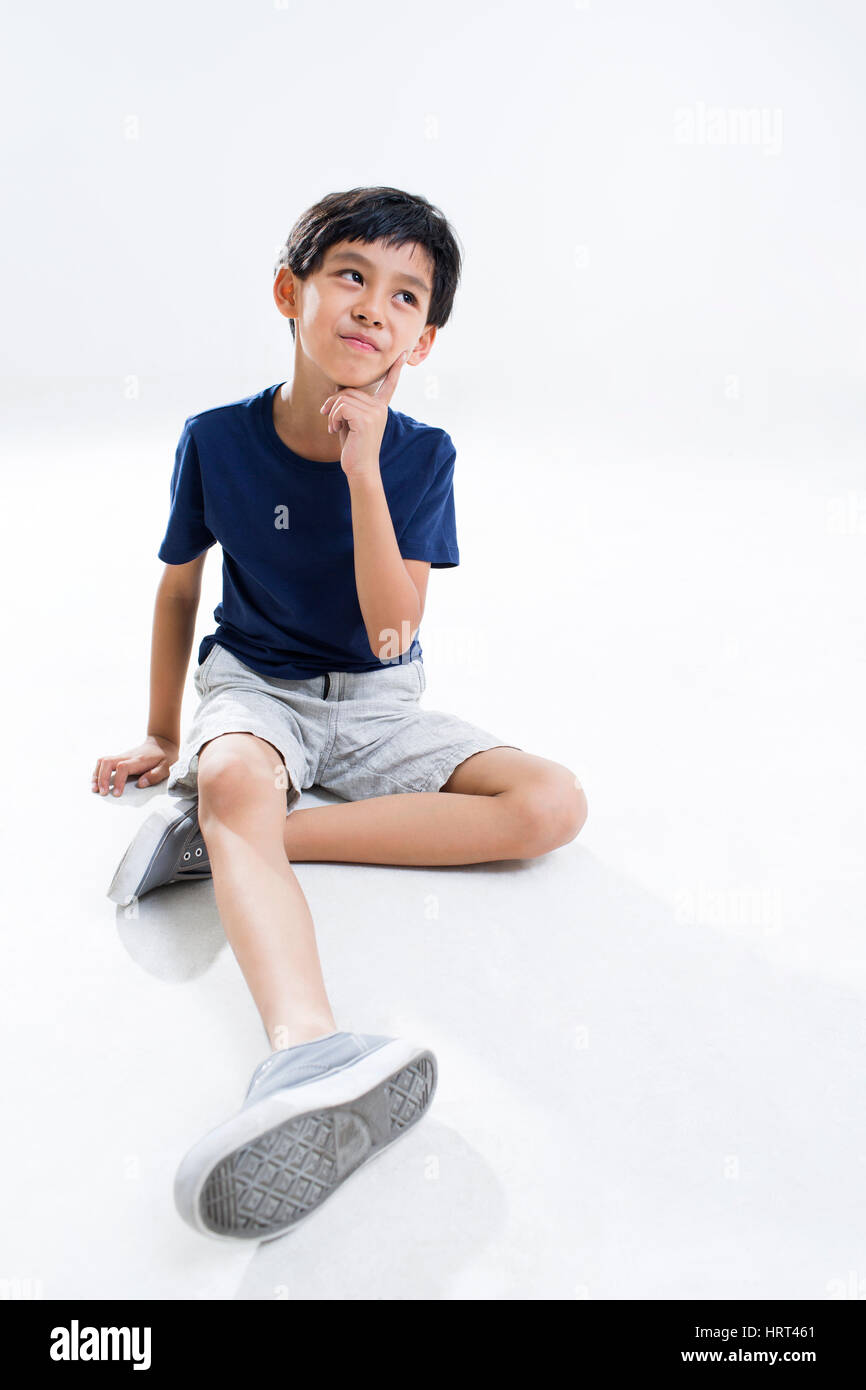 Cute boy thinking Stock Photo - Alamy