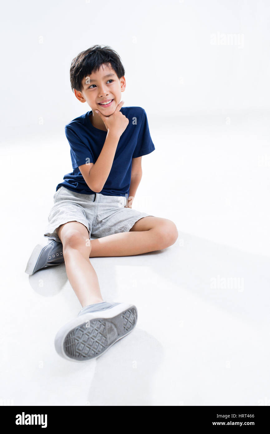 Cute boy thinking Stock Photo - Alamy