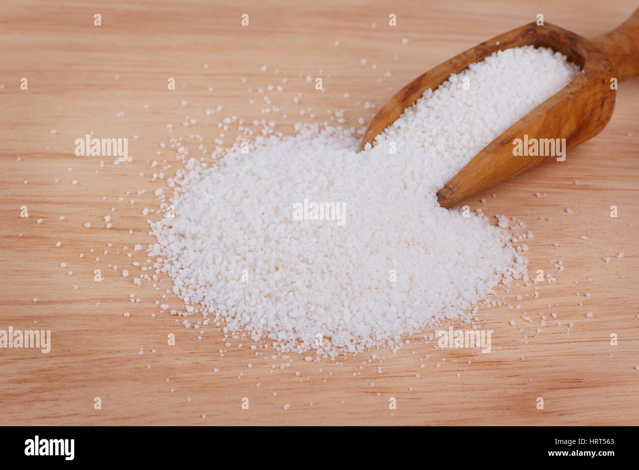 Granulated cassava (tapioca) on wooden background. Selective focus ...