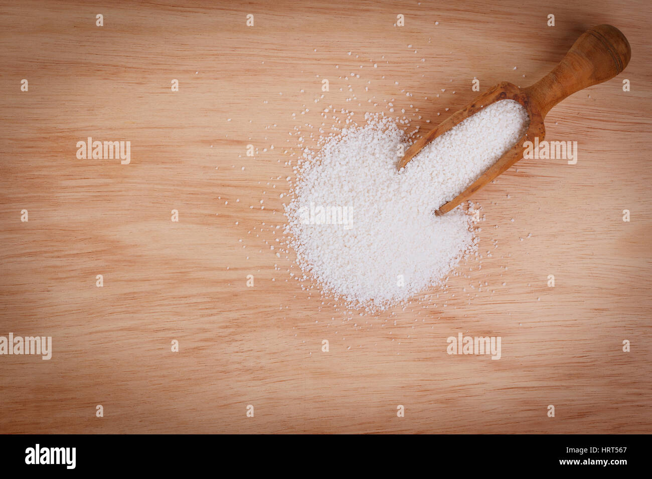 Granulated cassava (tapioca) on wooden background. Selective focus ...
