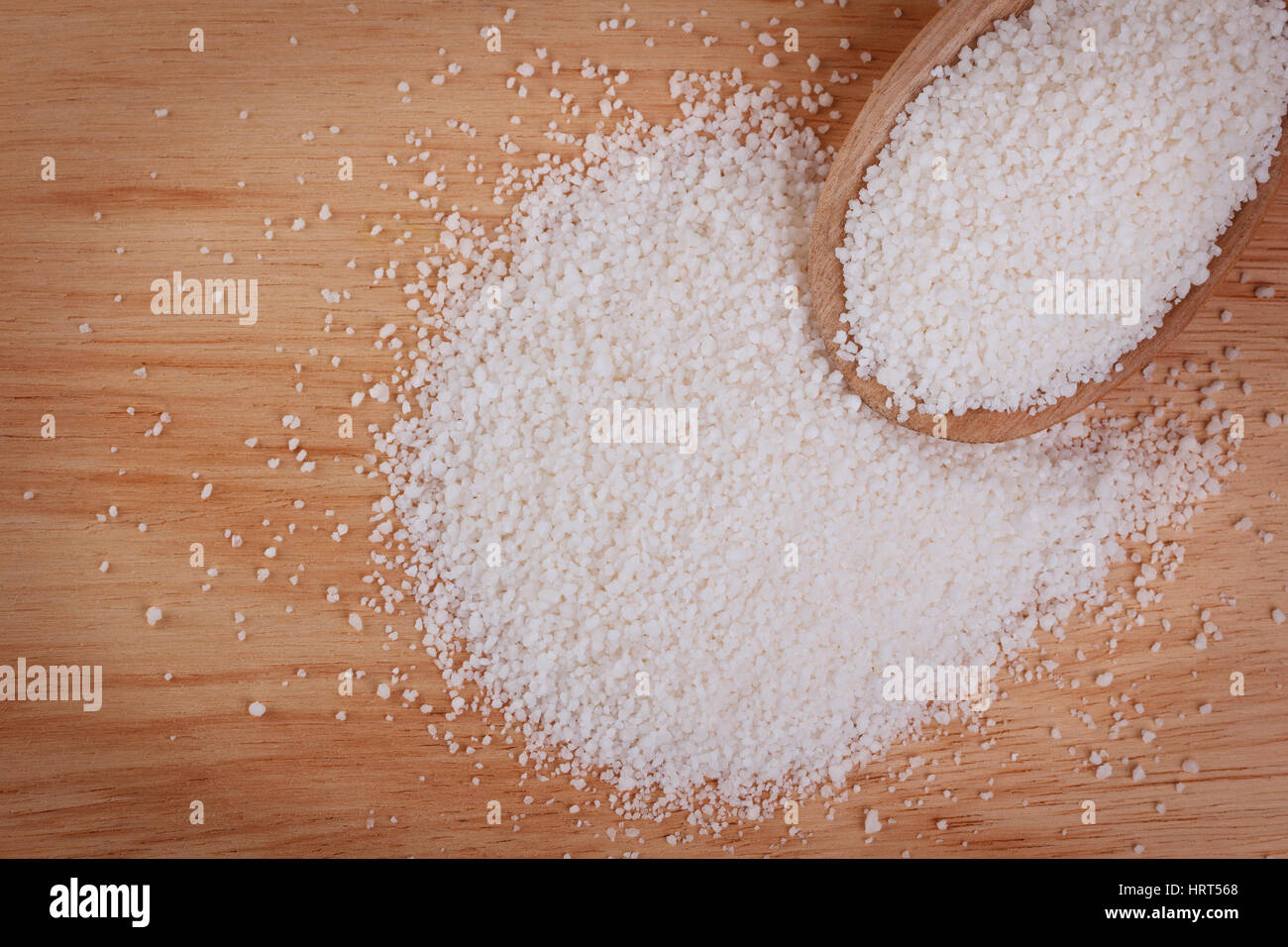 Granulated cassava (tapioca) on wooden background. Selective focus ...