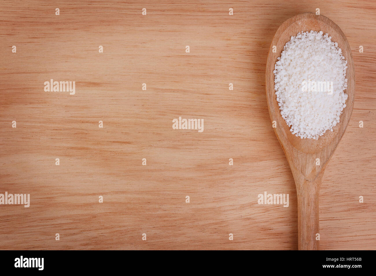 Granulated cassava (tapioca) on wooden background. Selective focus ...