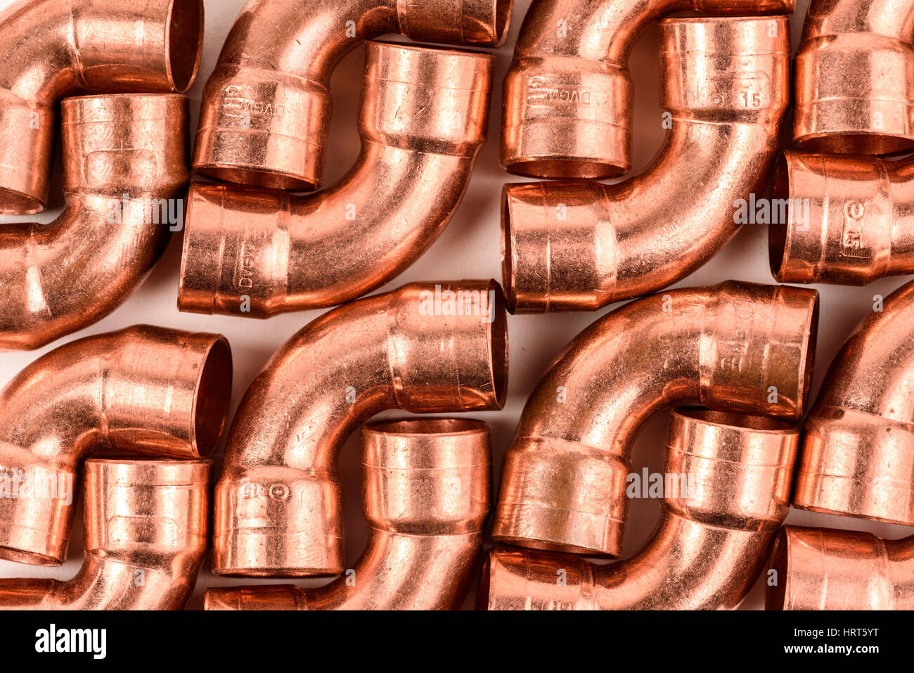 Copper elbow, copper pipe, industrial background Stock Photo - Alamy