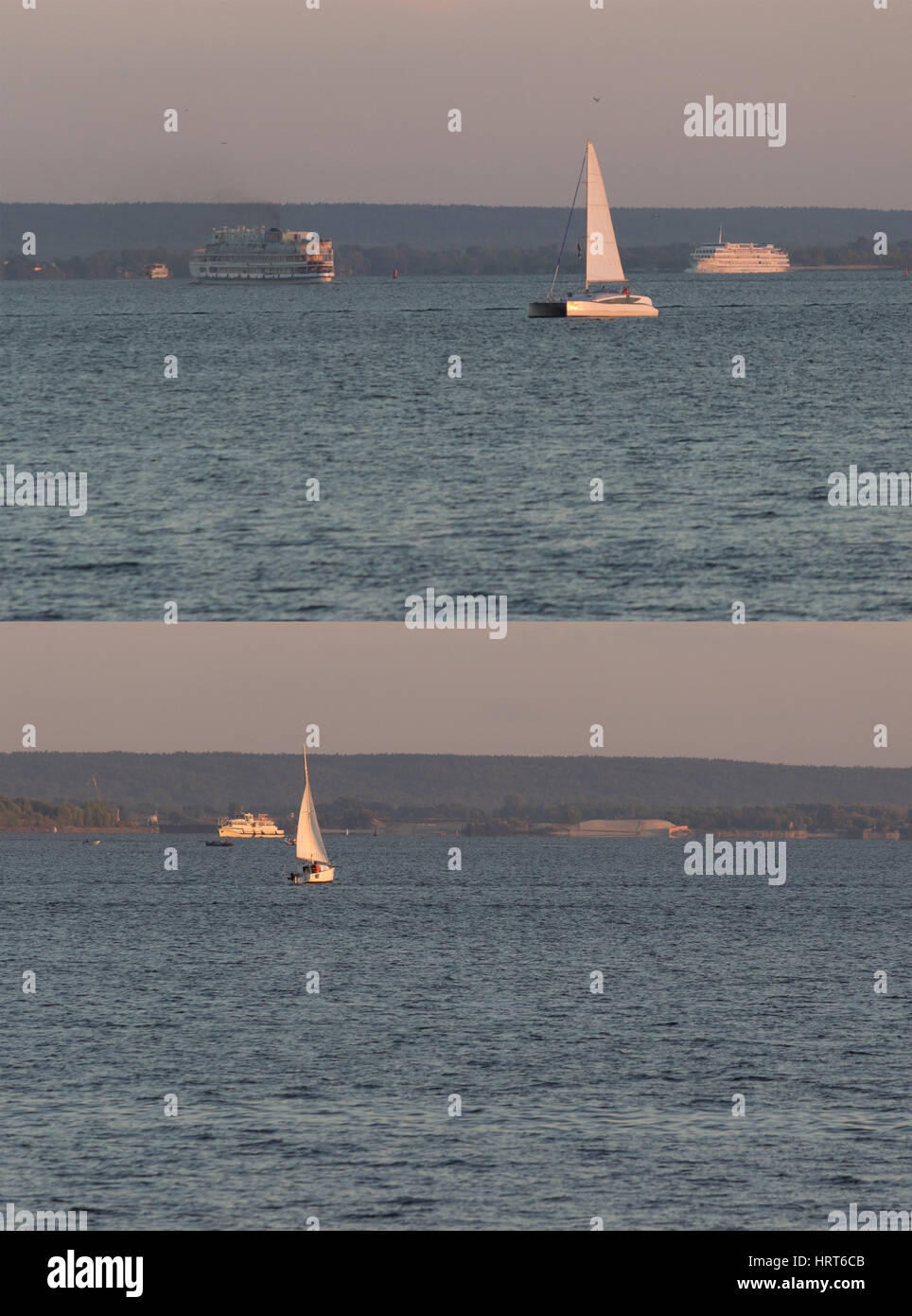 distant sailing boats on the water. vertical Stock Photo - Alamy