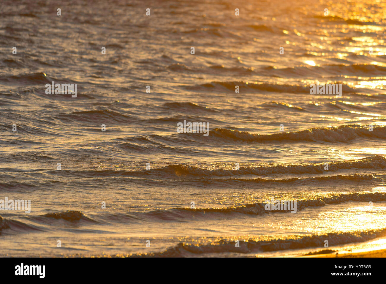 sun reflection on ocean waves. close up background Stock Photo - Alamy