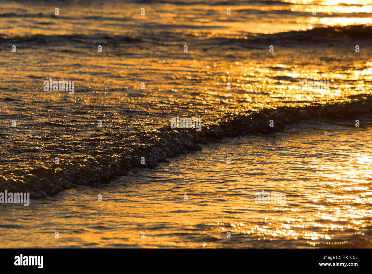 sun reflection on ocean waves. close up background Stock Photo - Alamy