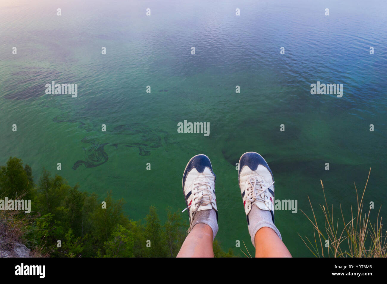 Feet hanging in the air. above the sea Stock Photo - Alamy