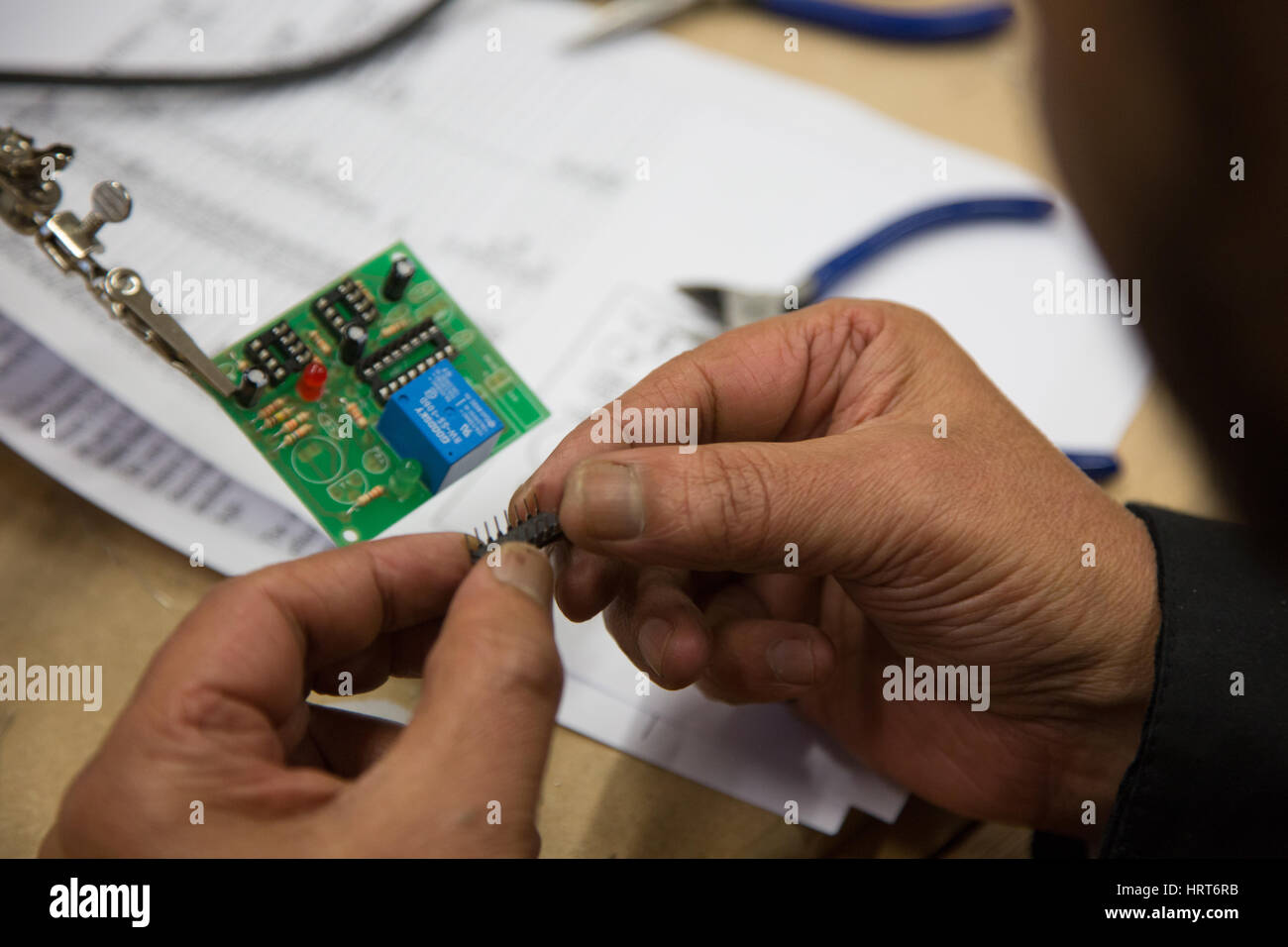 Working on an electric circuit board Stock Photo - Alamy
