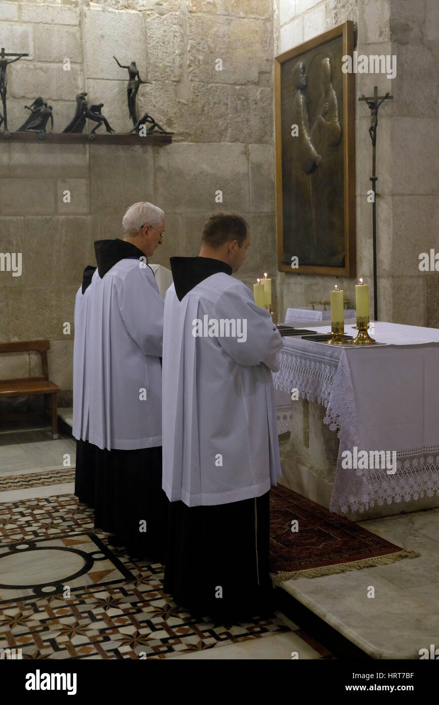 Franciscan friars praying inside the Roman Catholic Chapel of the ...