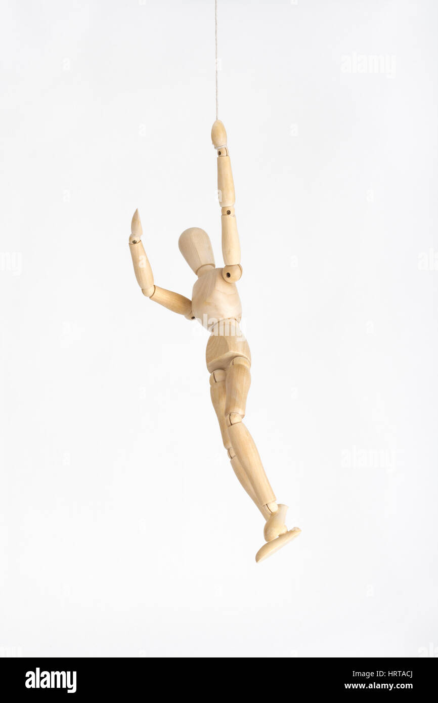 Artist's mannequin hanging mid-air by a piece of string - metaphor ...