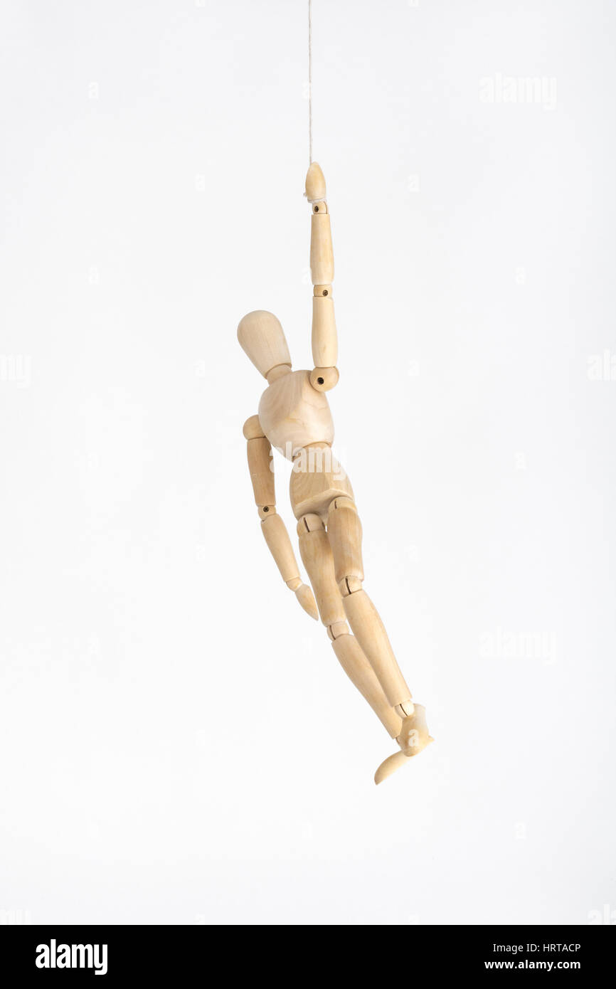 Artist's mannequin hanging mid-air by a piece of string - metaphor ...