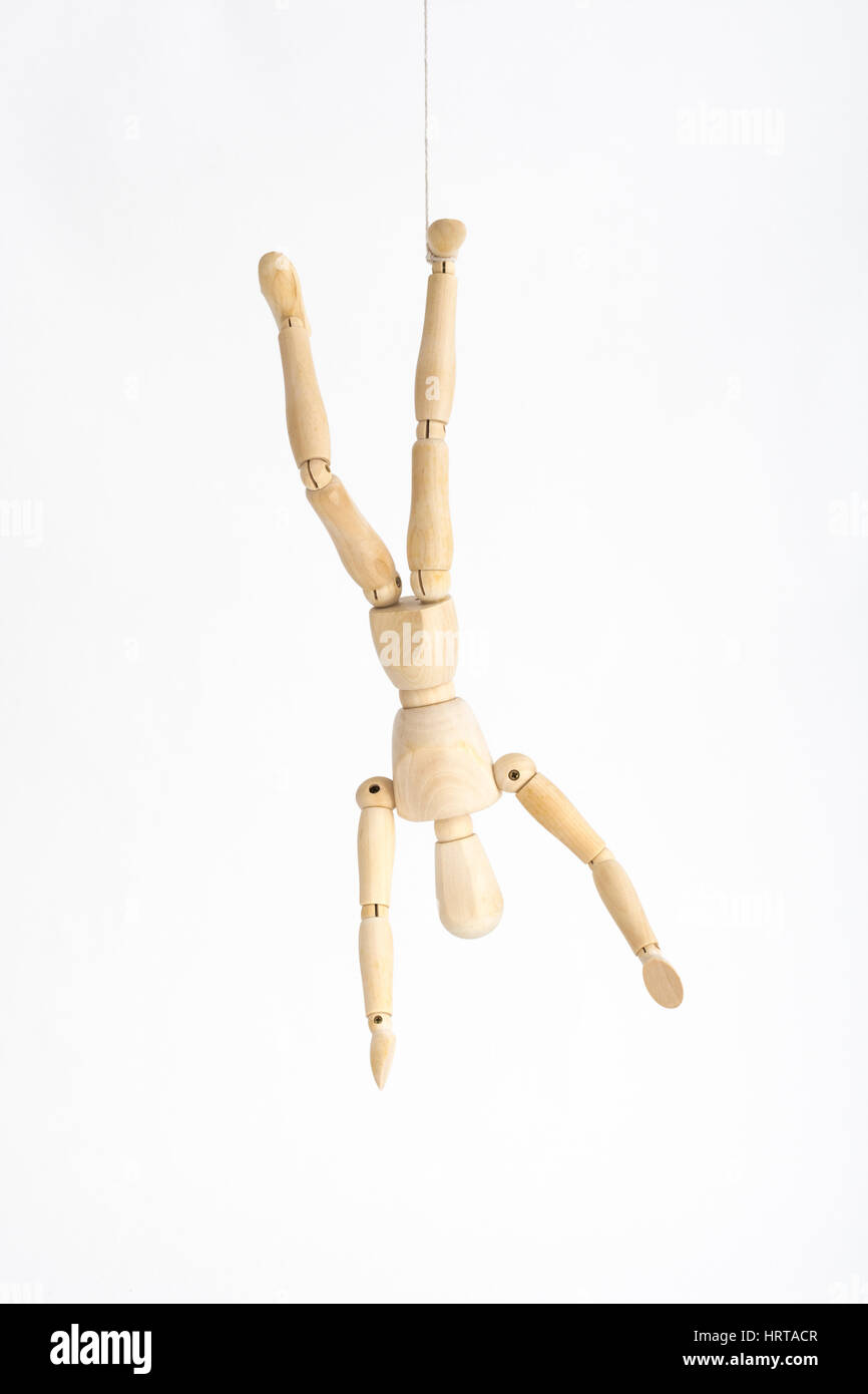 Artist's mannequin hanging mid-air by a piece of string - metaphor for ...