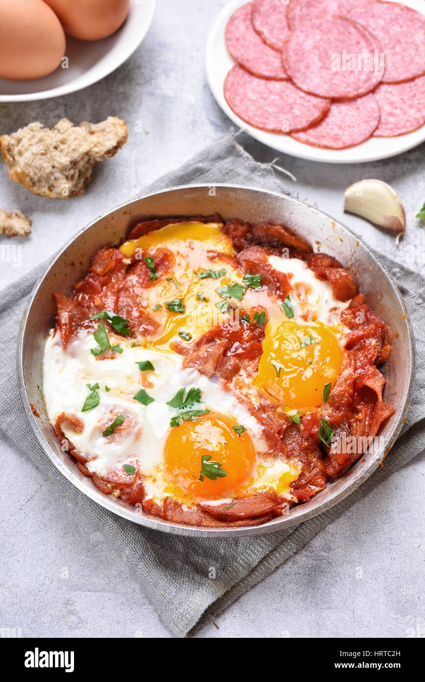 Fried eggs with bacon in frying pan. Dish for breakfast Stock Photo - Alamy
