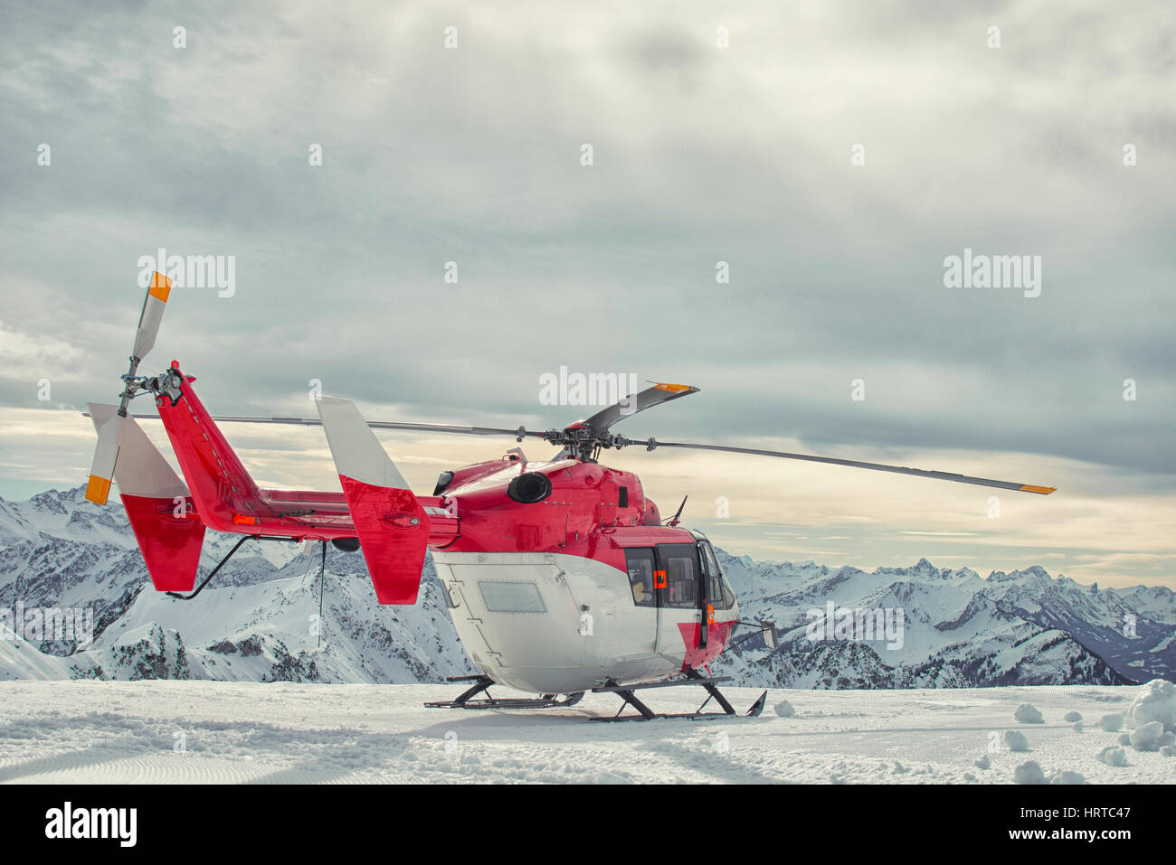 Helicopter mountain rescue service in the winter Stock Photo - Alamy