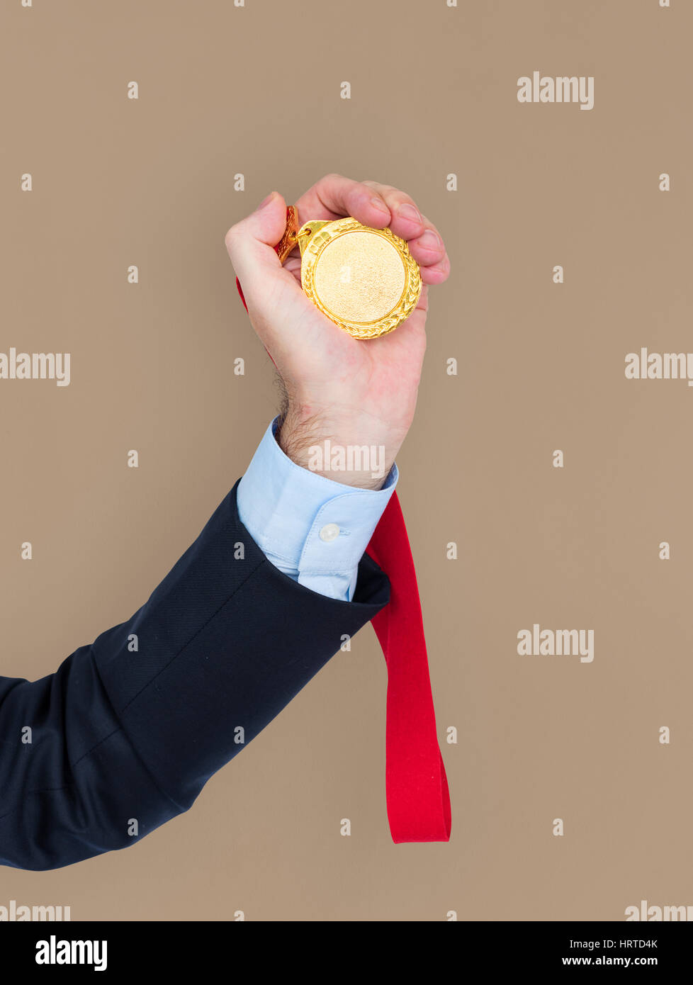 Hand holding medal hi-res stock photography and images - Alamy
