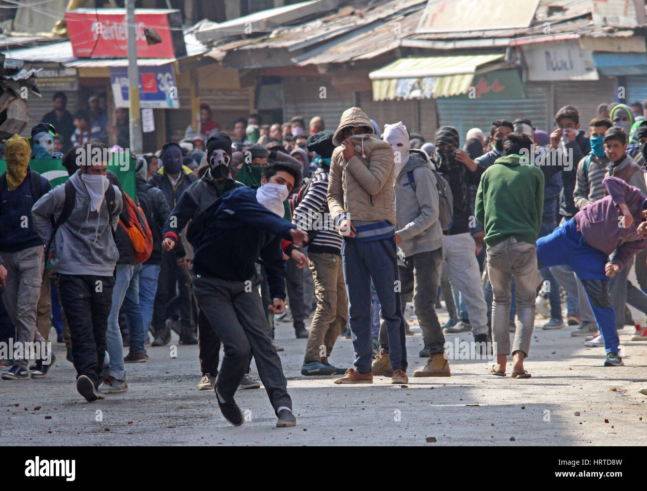 Srinagar, Kashmir. 03rd Mar, 2017. A Kashmiri Muslim youth throwing ...