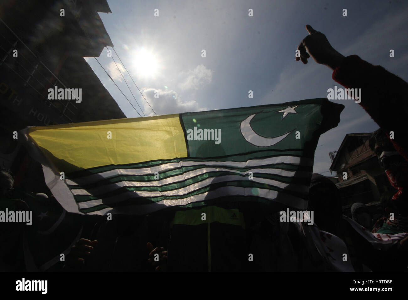 Srinagar, Kashmir. 03rd Mar, 2017. Masked youth shouting pro-freedom ...