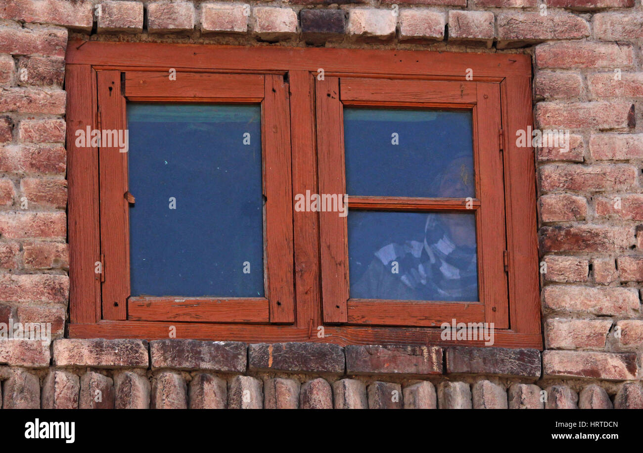 Srinagar, Kashmir. 03rd Mar, 2017. A Kashmiri muslim woman watching the ...