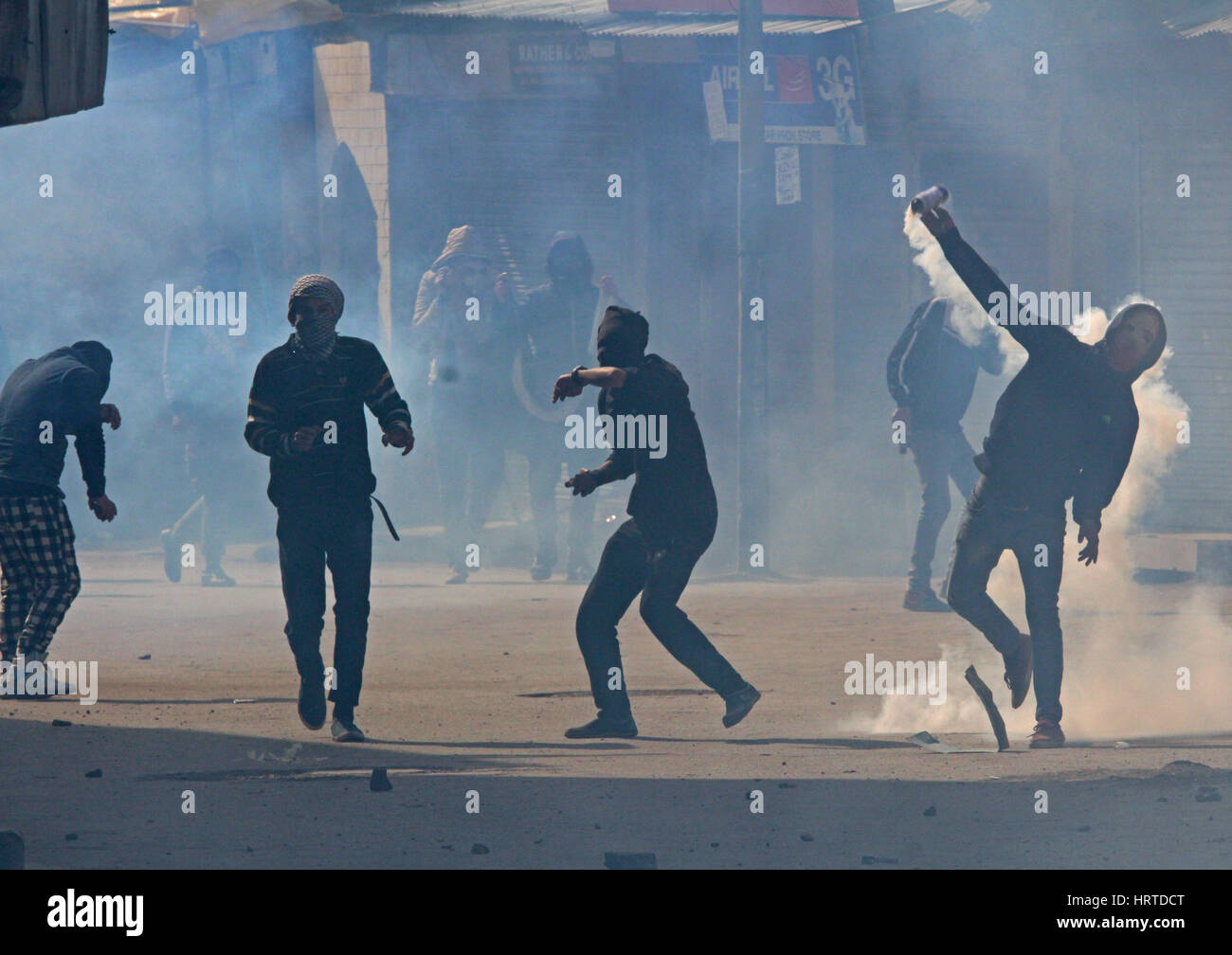 Srinagar, Kashmir. 03rd Mar, 2017. A Kashmiri Muslim youth throwing a ...