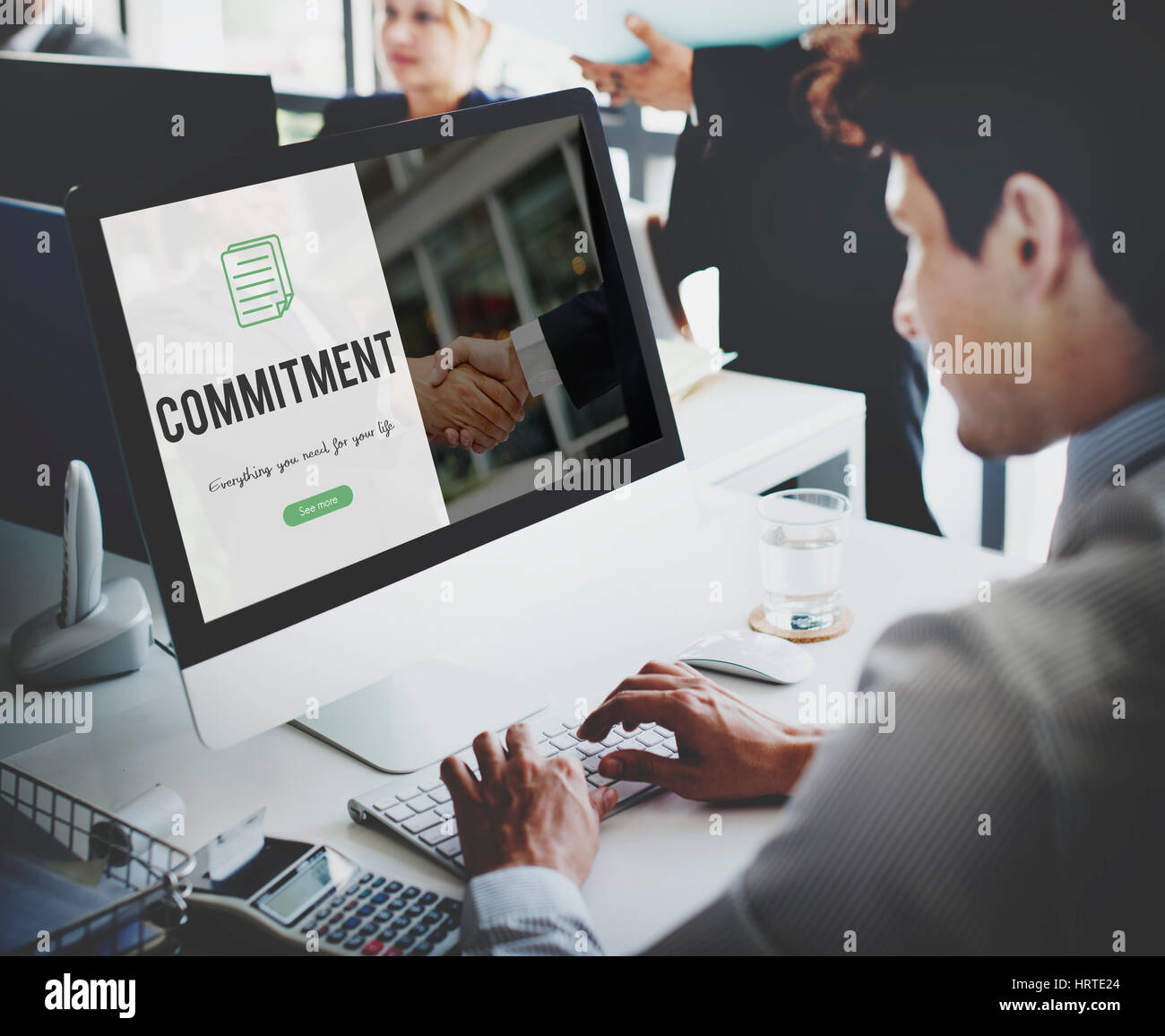 Commitment word on business handshake background Stock Photo - Alamy