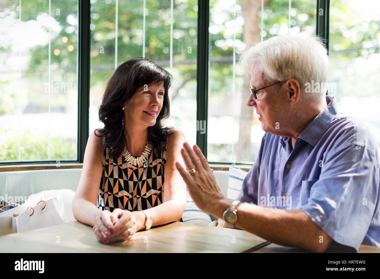 Old couple chatting on a date Stock Photo - Alamy
