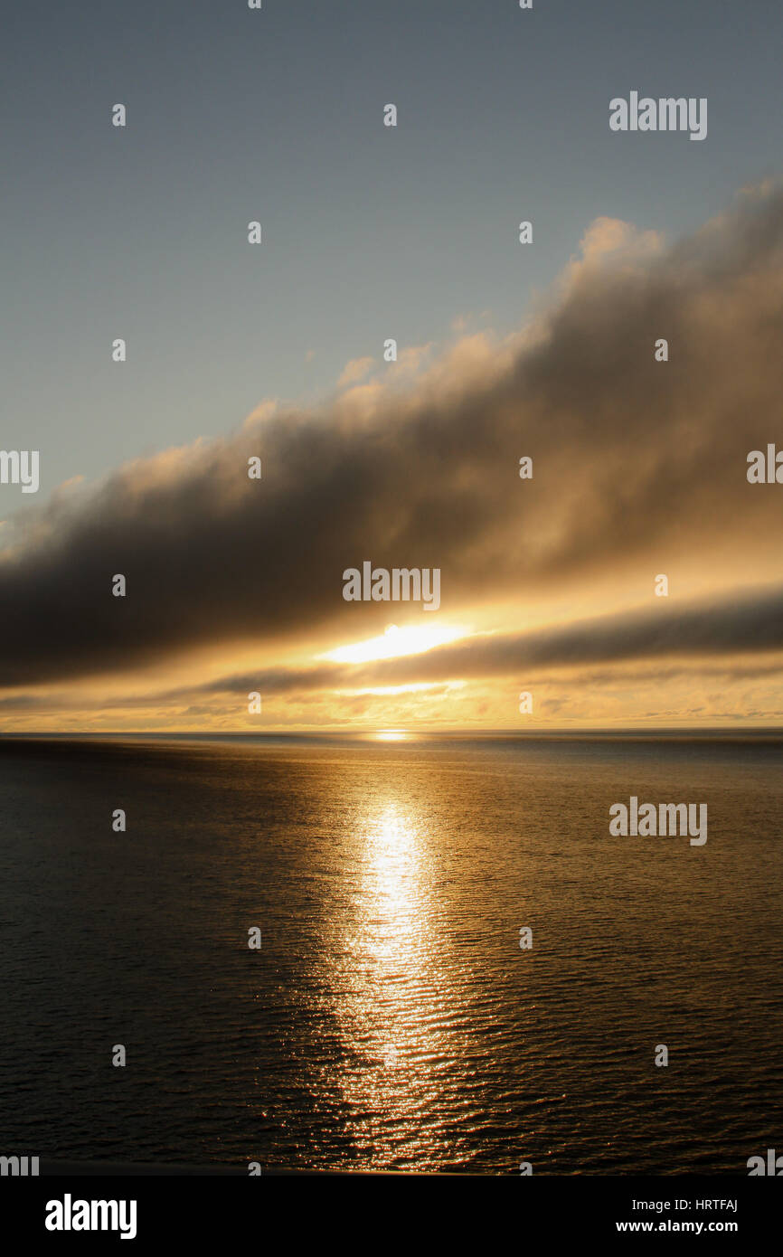 Picture of low level clouds over the sea during the sunset Stock Photo ...