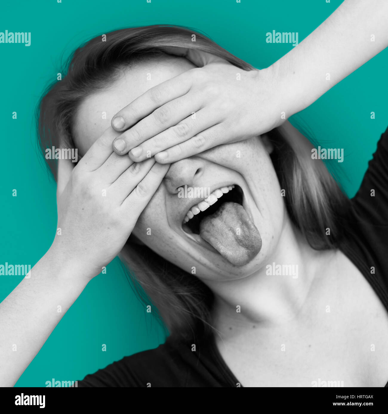 Young Cheerful Poking Tongue Portrait Stock Photo - Alamy