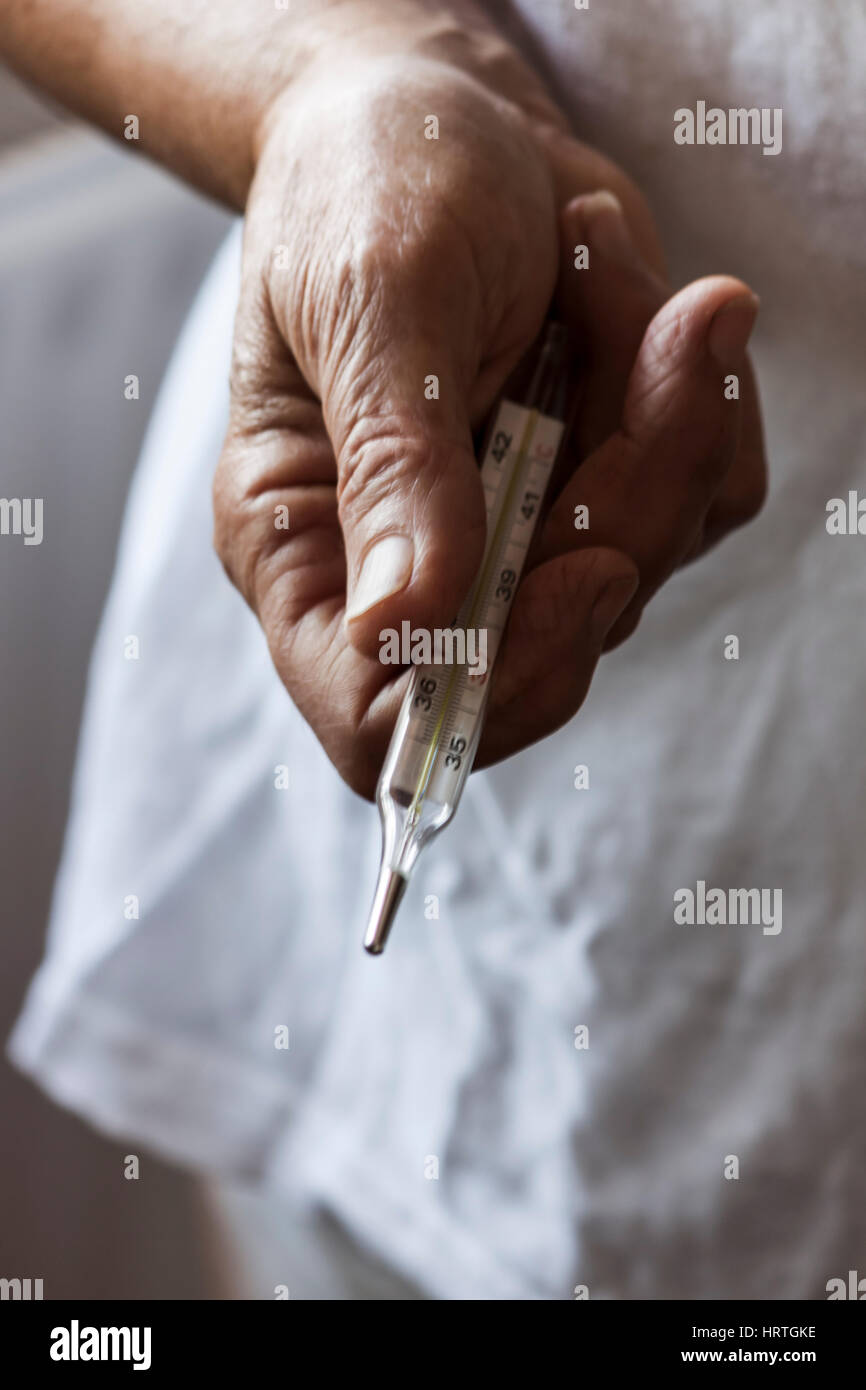 Hand checking temperature hi-res stock photography and images - Alamy