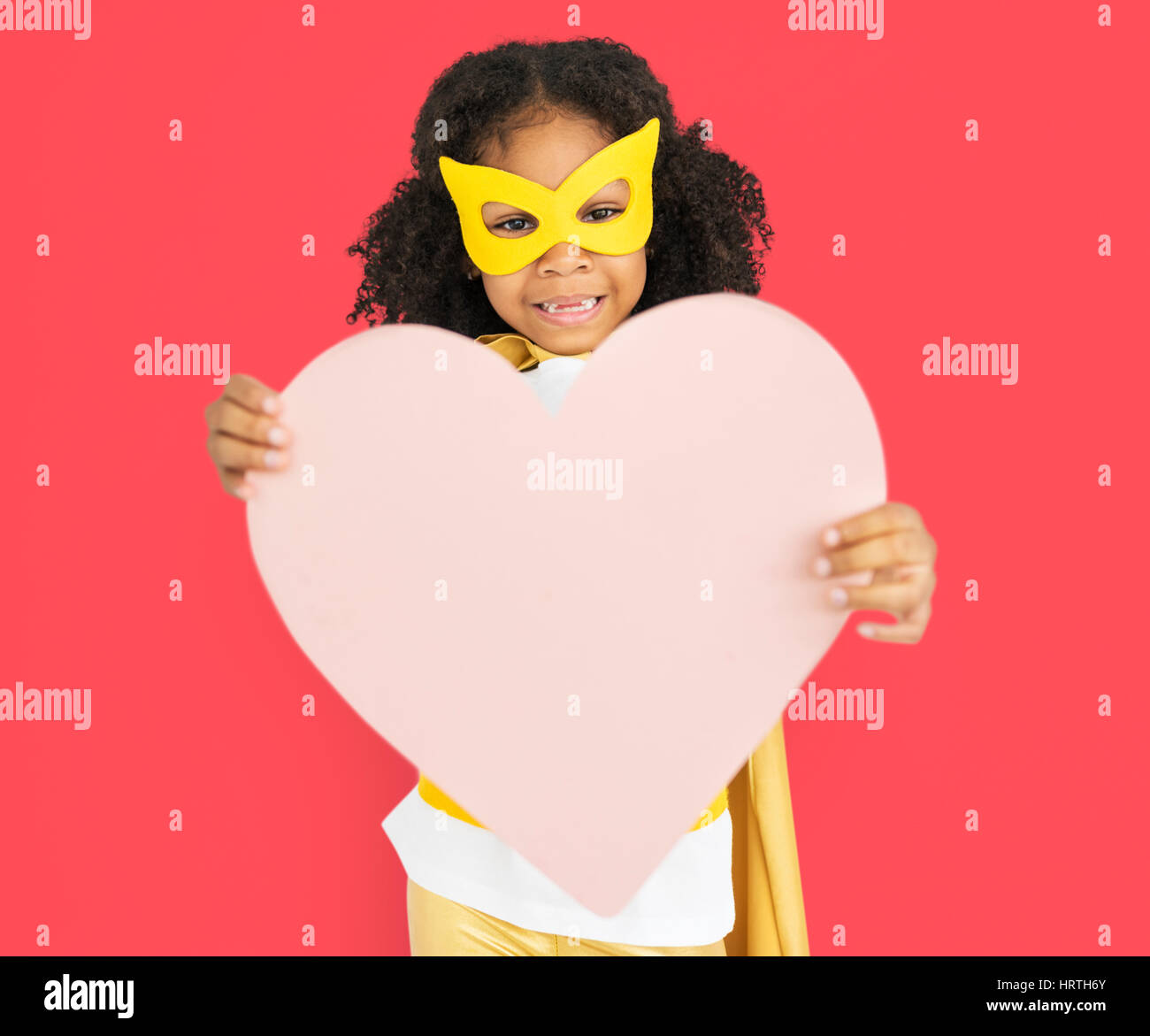 Superhero Kid Carrying Heart Concept Stock Photo - Alamy