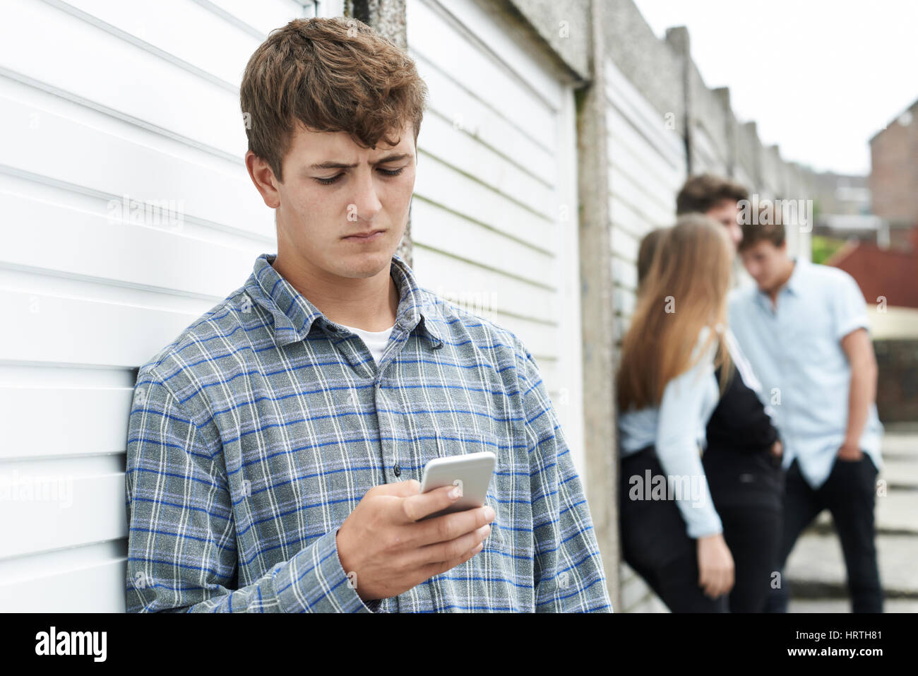 Teenage Boy Victim Of Bullying By Text Messaging Stock Photo - Alamy