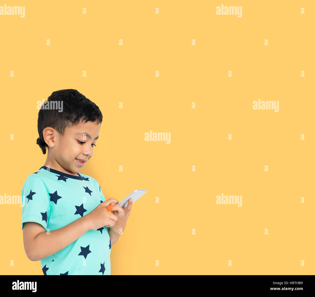 Little boy studio isolated with phone Stock Photo - Alamy