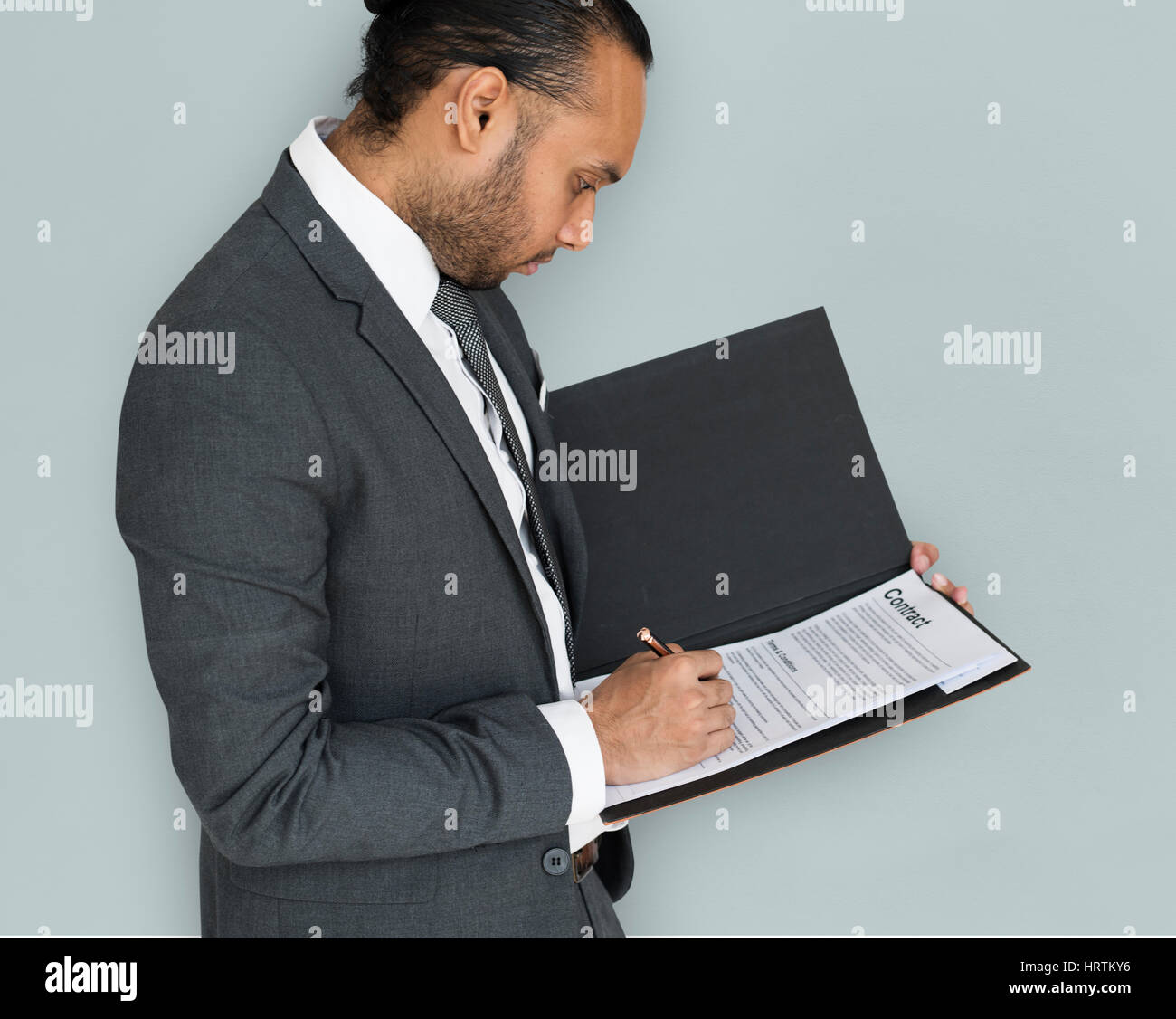 Asian man signing contract hi-res stock photography and images - Alamy