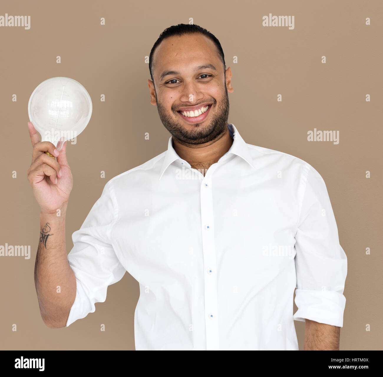 Indian Business Man Smiling Light Bulb Stock Photo - Alamy
