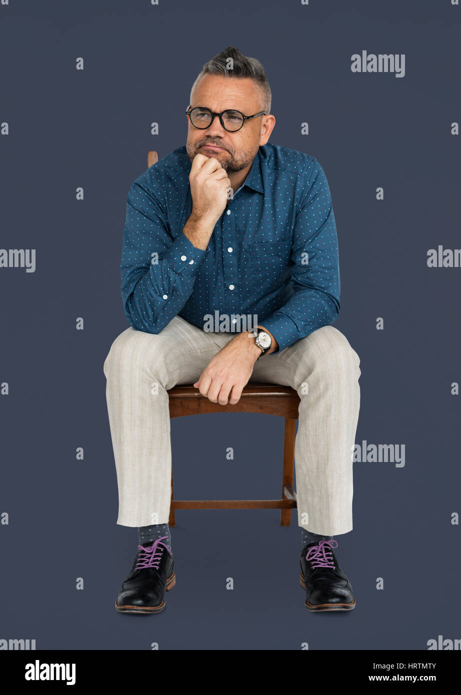 Caucasian Business Man Sitting Thinking Stock Photo - Alamy