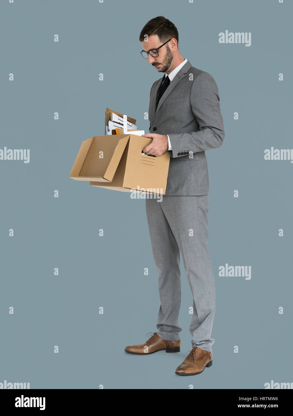 Caucasian Business Man Pack Up Retrenched Stock Photo - Alamy