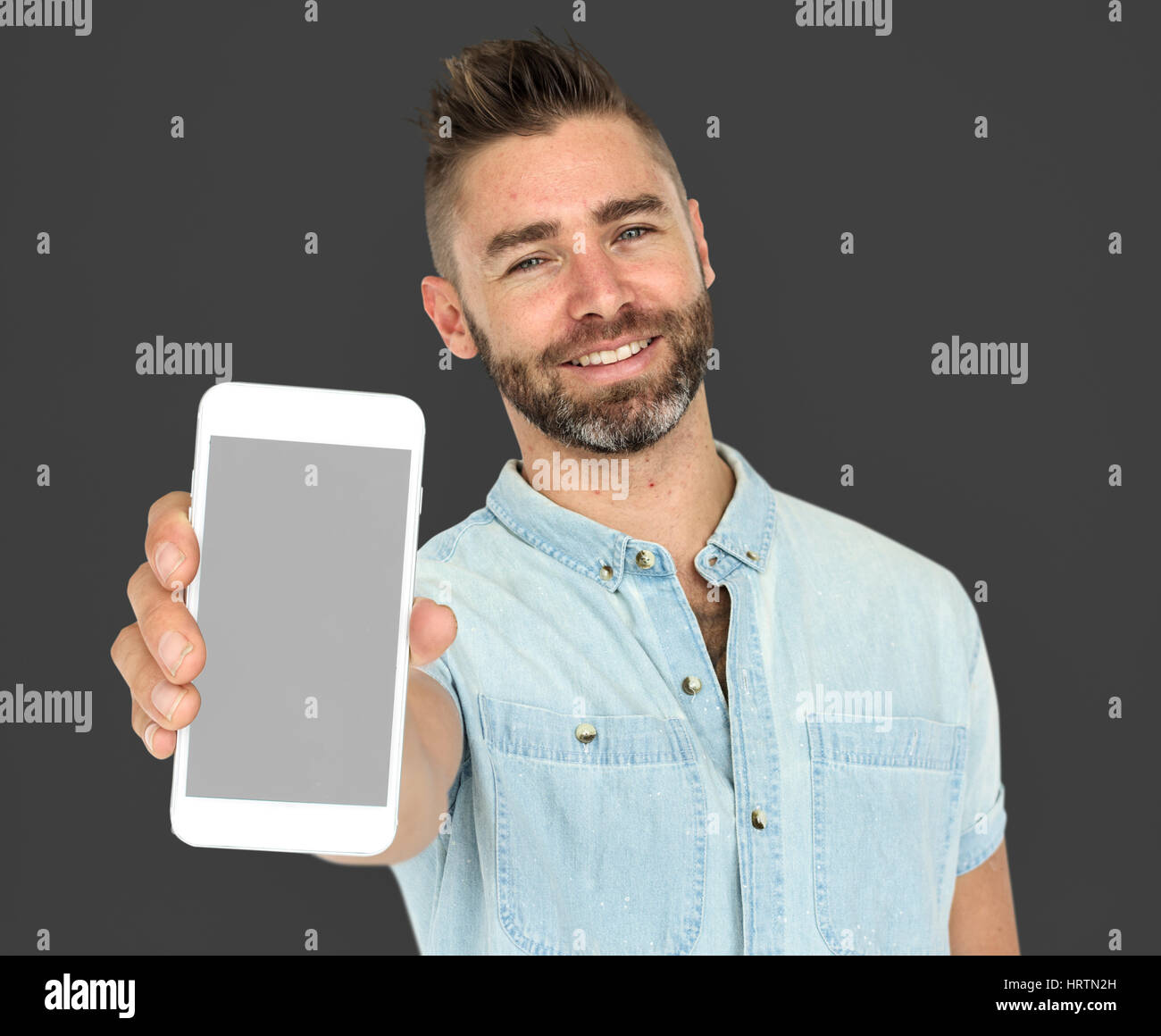Caucasian Man Holding Phone Smiling Stock Photo - Alamy