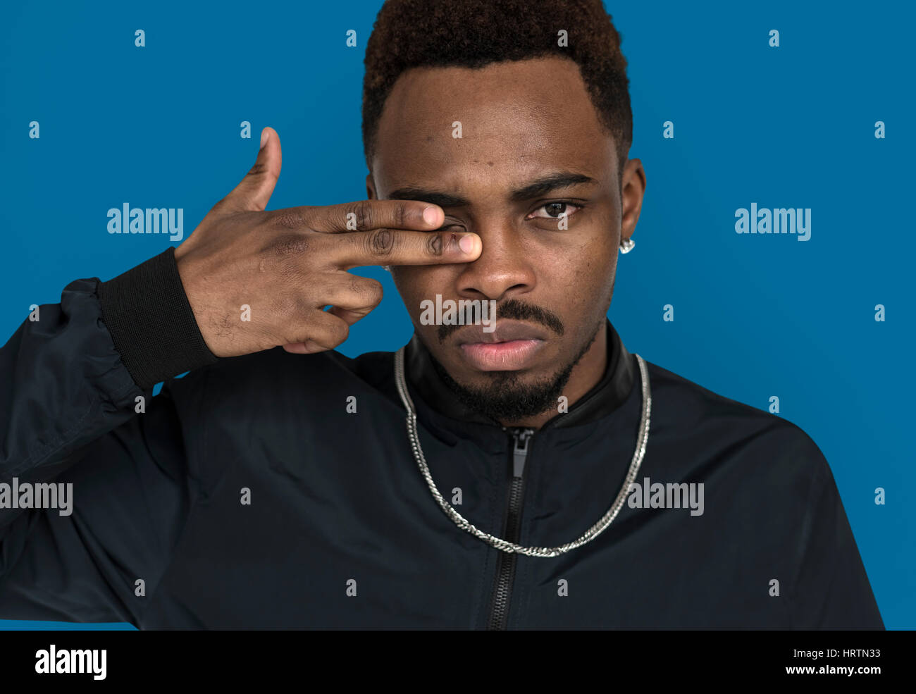African Descent Man Serious Hand Gesture Stock Photo - Alamy