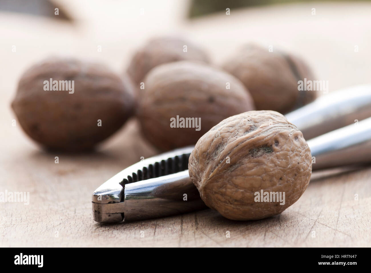 Walnut and nutcracker Stock Photo - Alamy