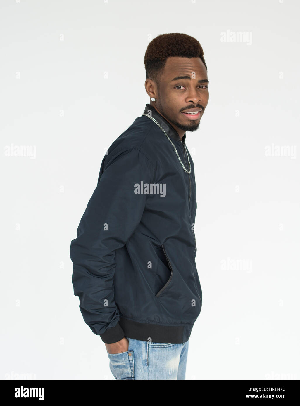 Black guy sideview hands in pockets Stock Photo - Alamy